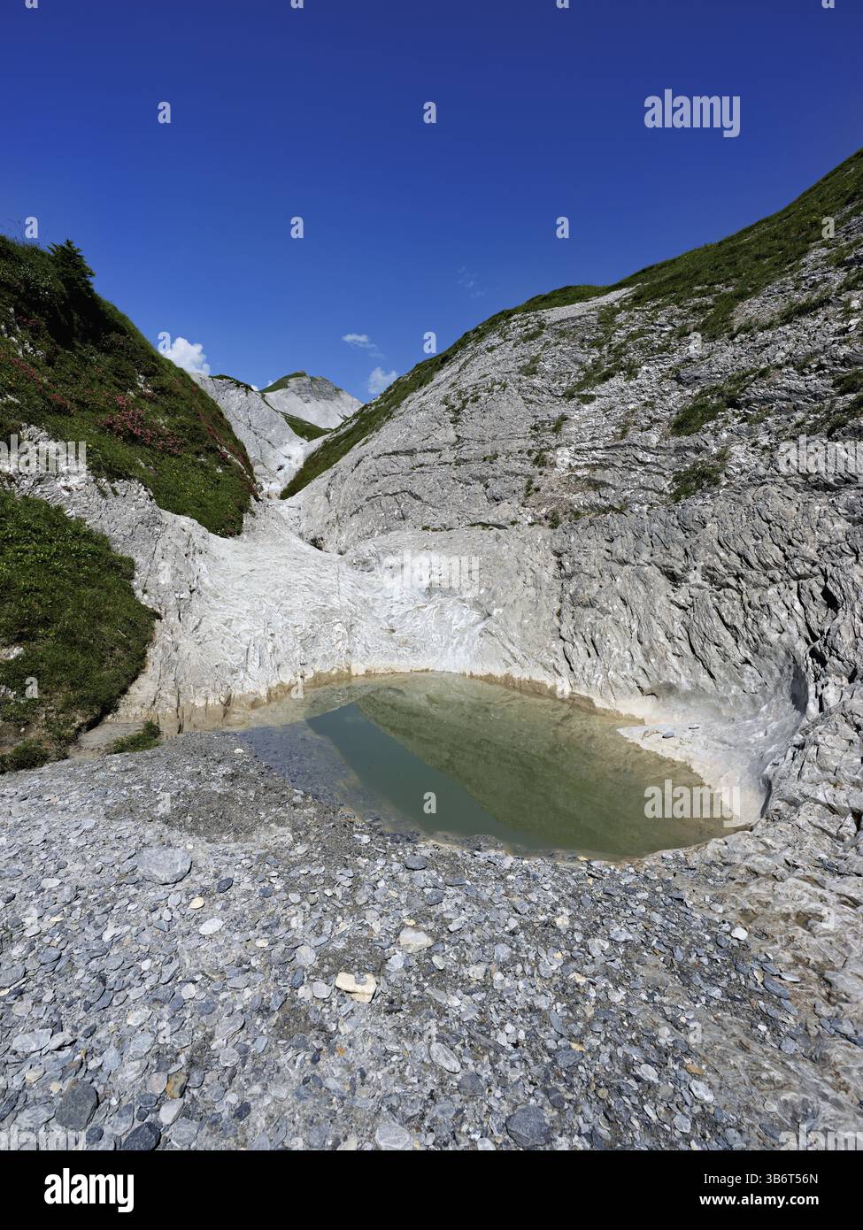 Glacier mill with glacier pots on the Trinser Alp Mora, Trin, Canton ...