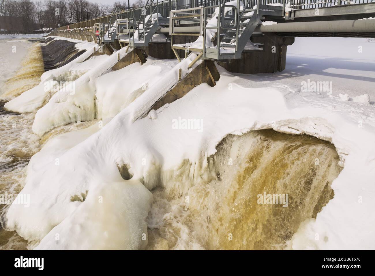 Water flowing through water control gates and Hydraulic Jumps at base ...