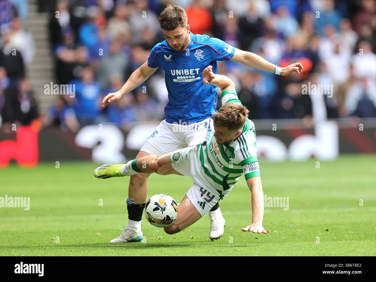 Celtic's James Forrest (right) and Rangers' Nicolas Raskin battle for ...