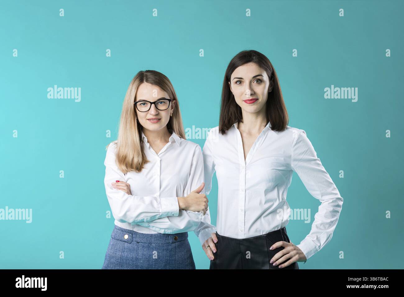 The theme is a female team. portrait of two young caucasian business ...