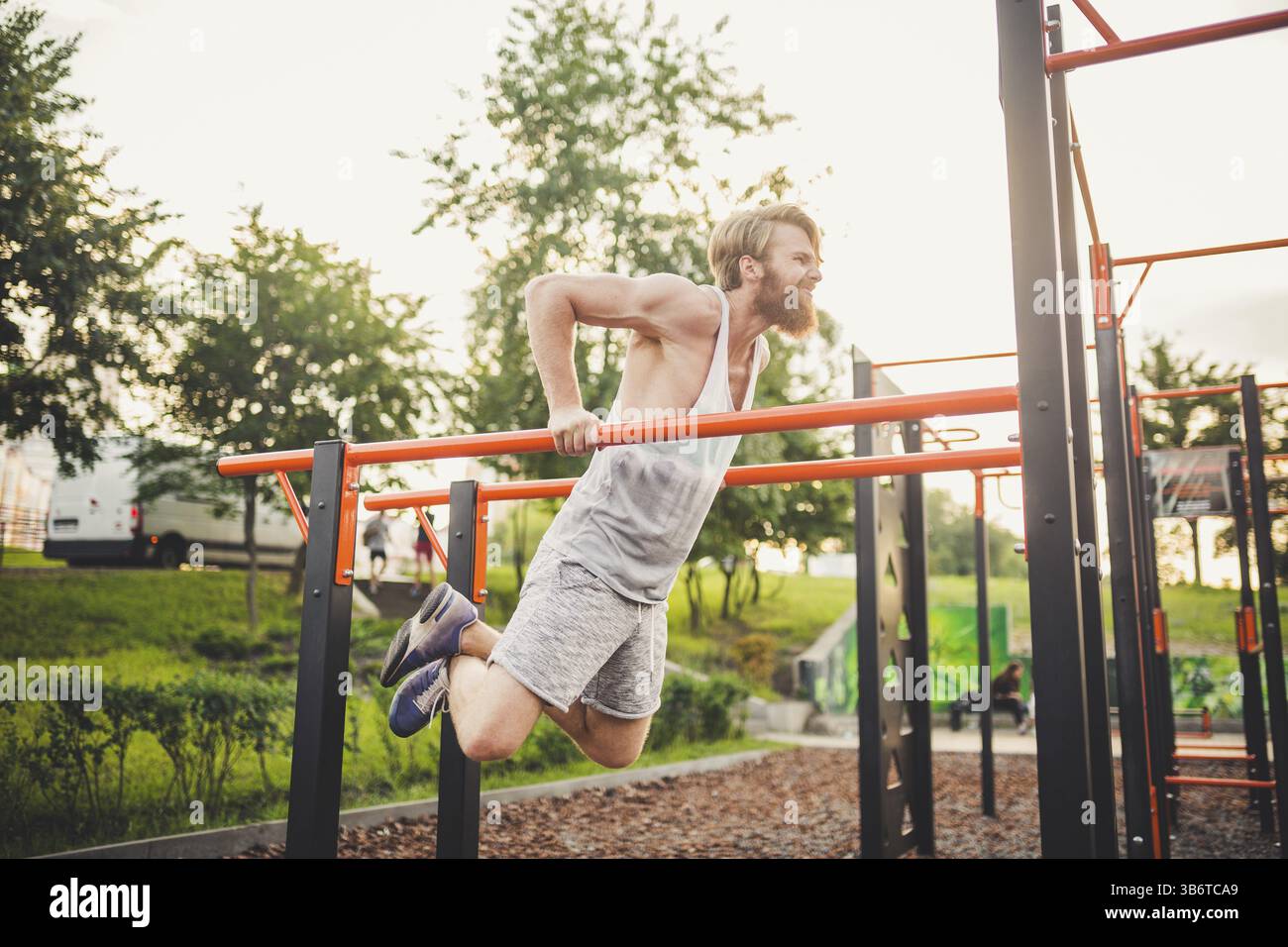 Fit Man Workout Out Arms On Dips Horizontal Bars Training Triceps And ...