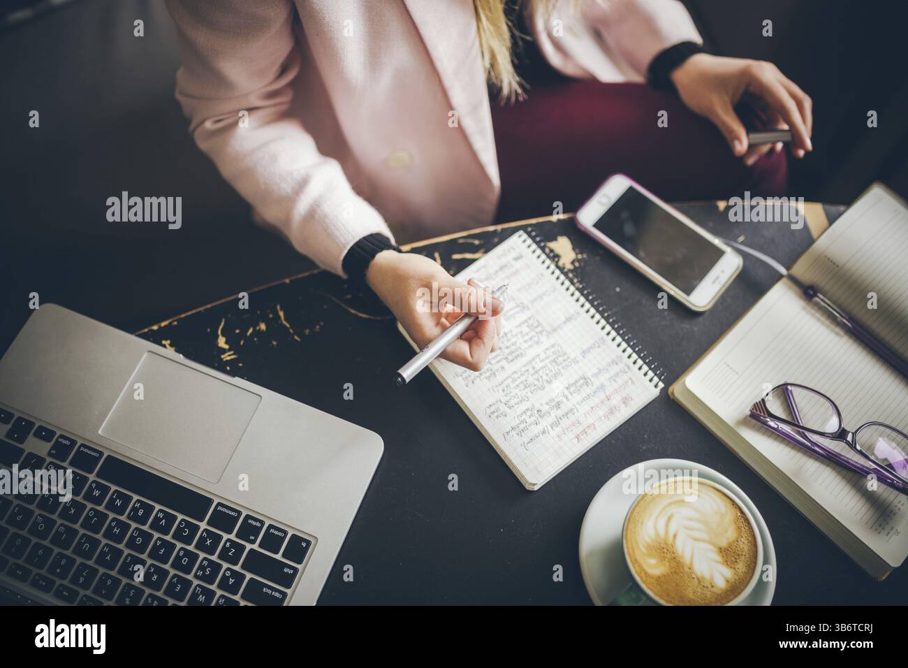 Pensive woman makes notes in hi-res stock photography and images - Alamy