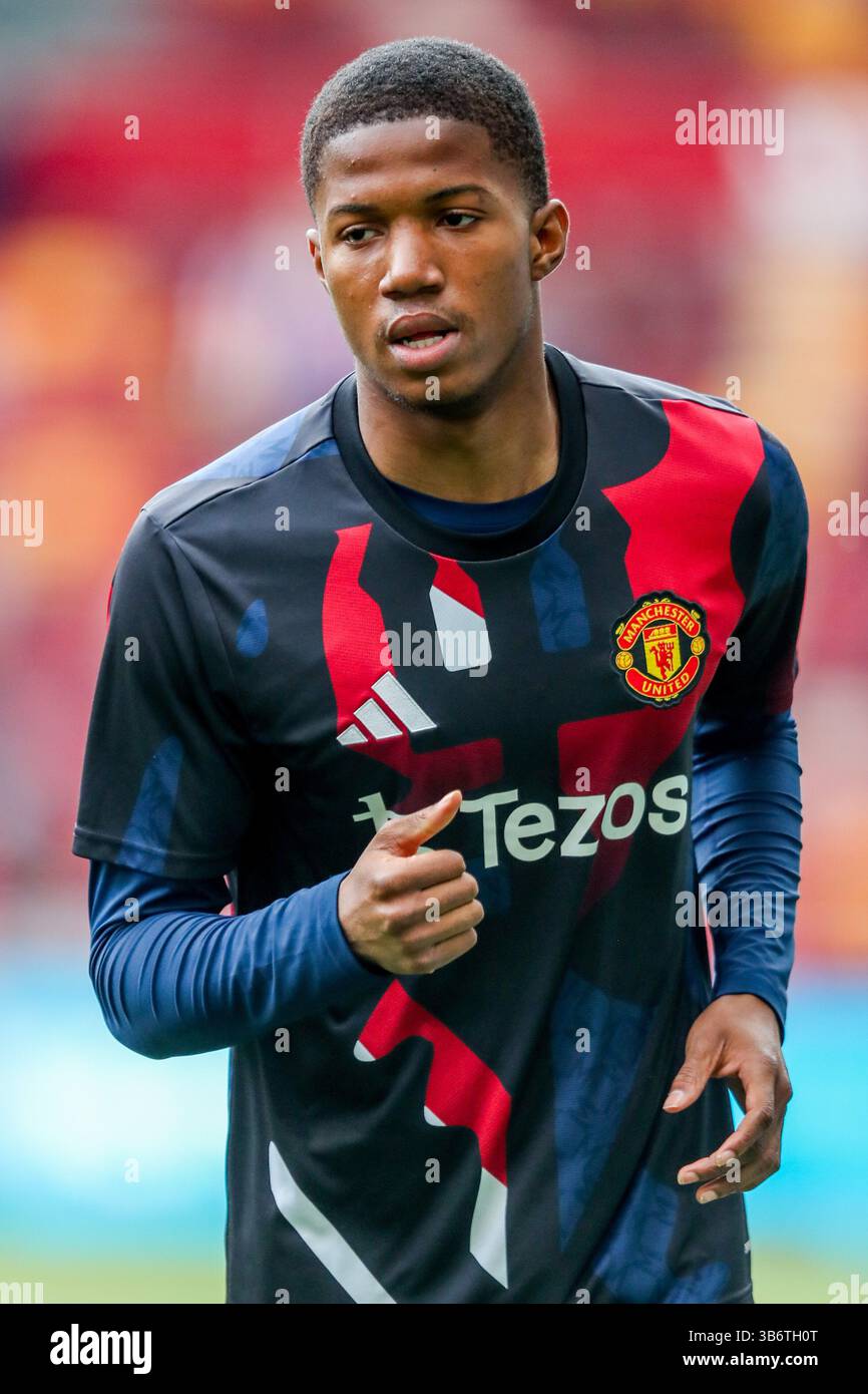 Chido Obi-Martin of Manchester United warms up prior to the Premier ...