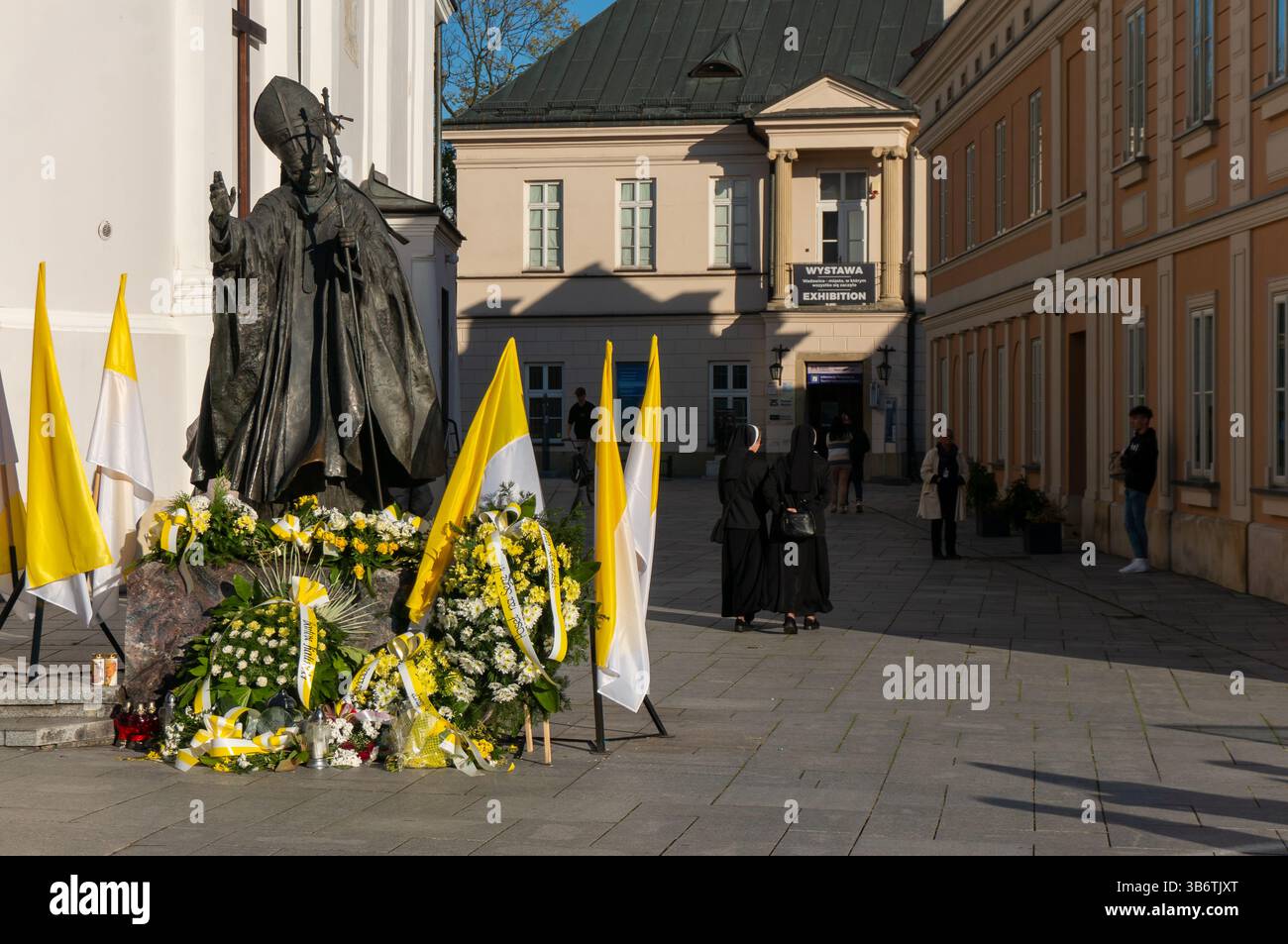 Monument to Pope John Paul II between Family house of Karol Wojtyła and ...