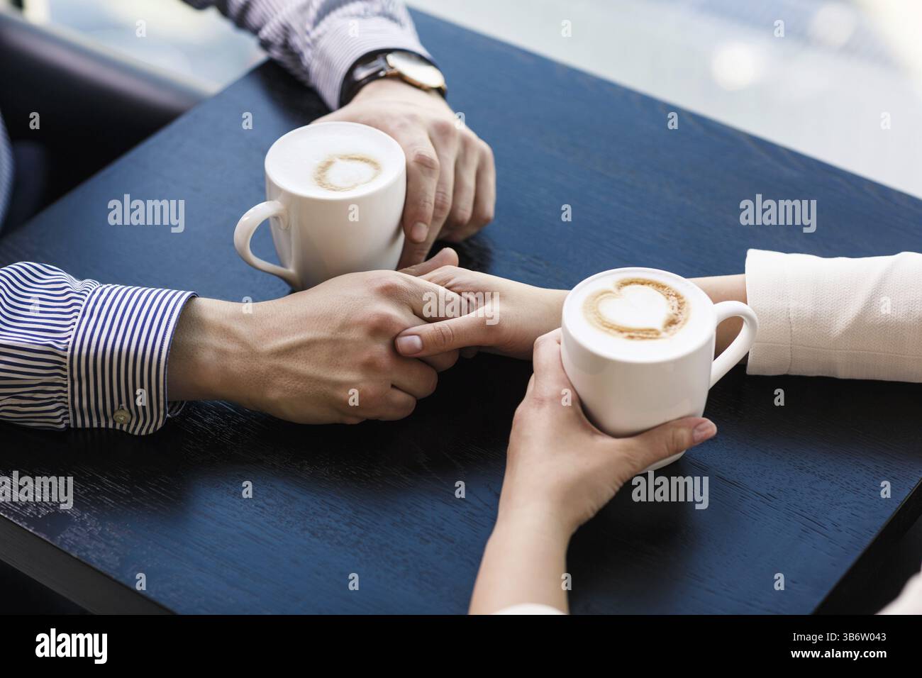 Male female hands coffee hi-res stock photography and images - Alamy
