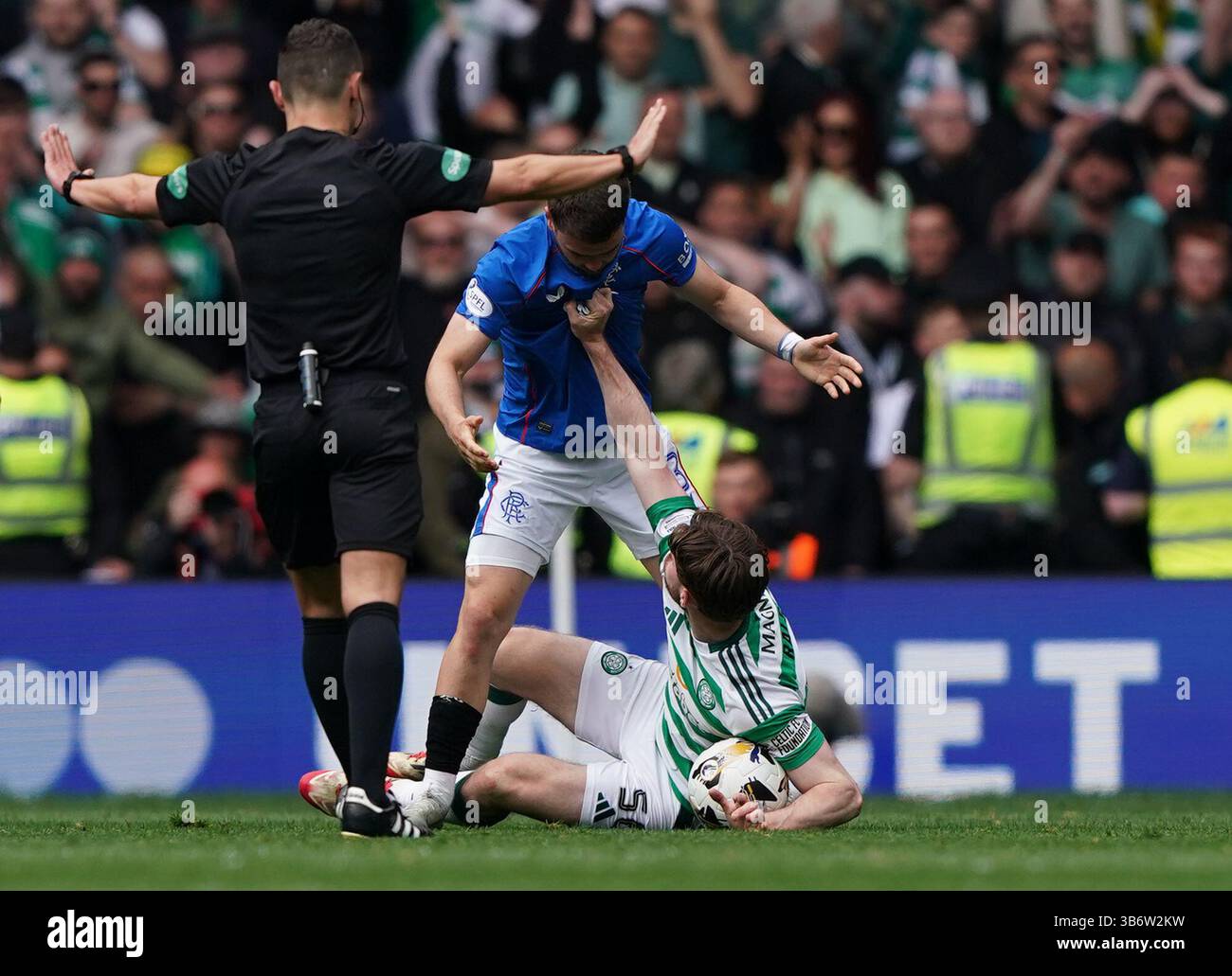 Rangers' Nicolas Raskin (left) and Celtic's Anthony Ralston clash ...