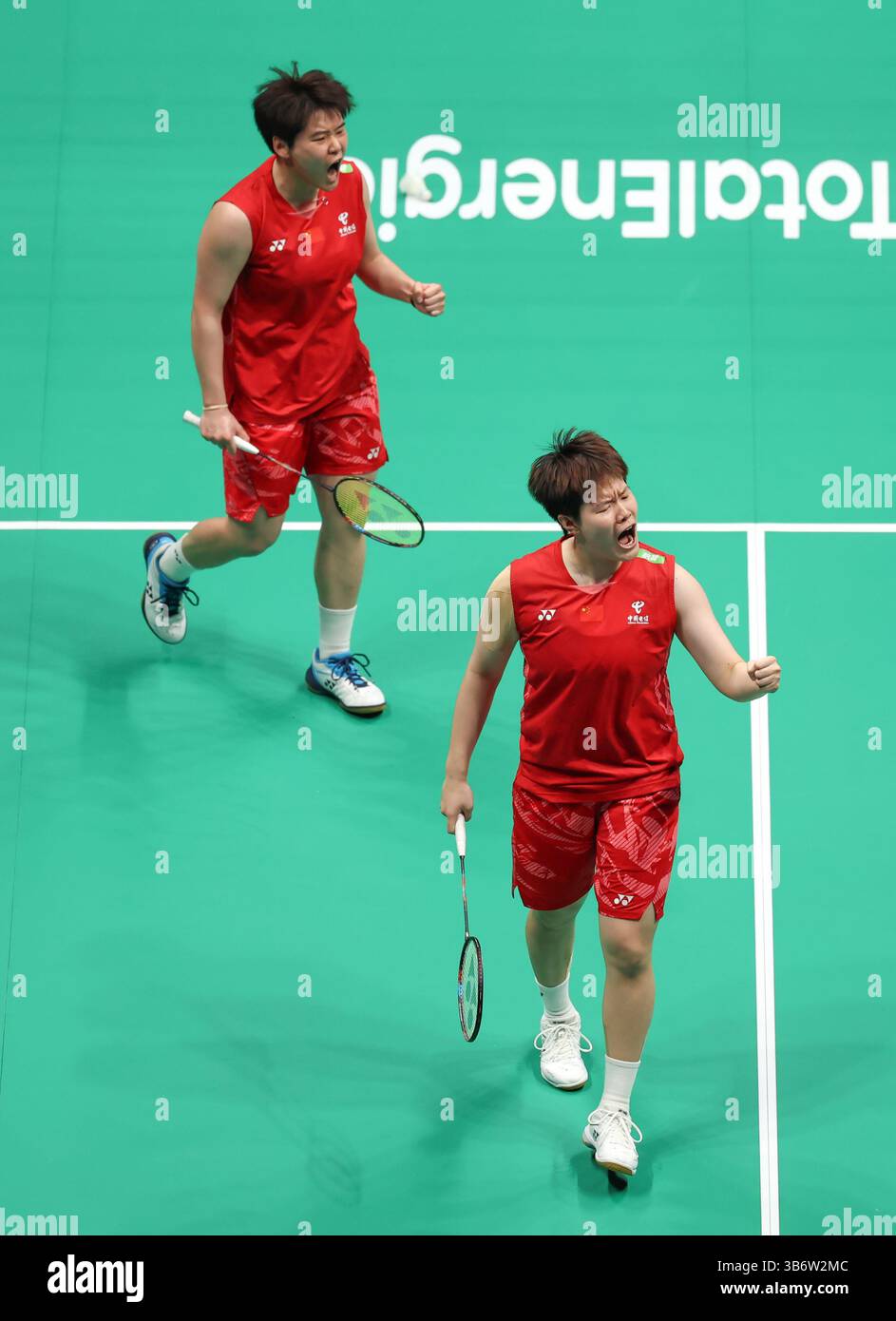 (250504) -- XIAMEN, May 4, 2025 (Xinhua) -- Liu Shengshu (R)/Tan Ning of China celebrate scoring ...