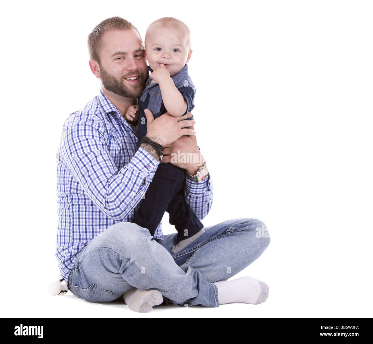 Casual father and son sitting on white isolated background, Toronto ...