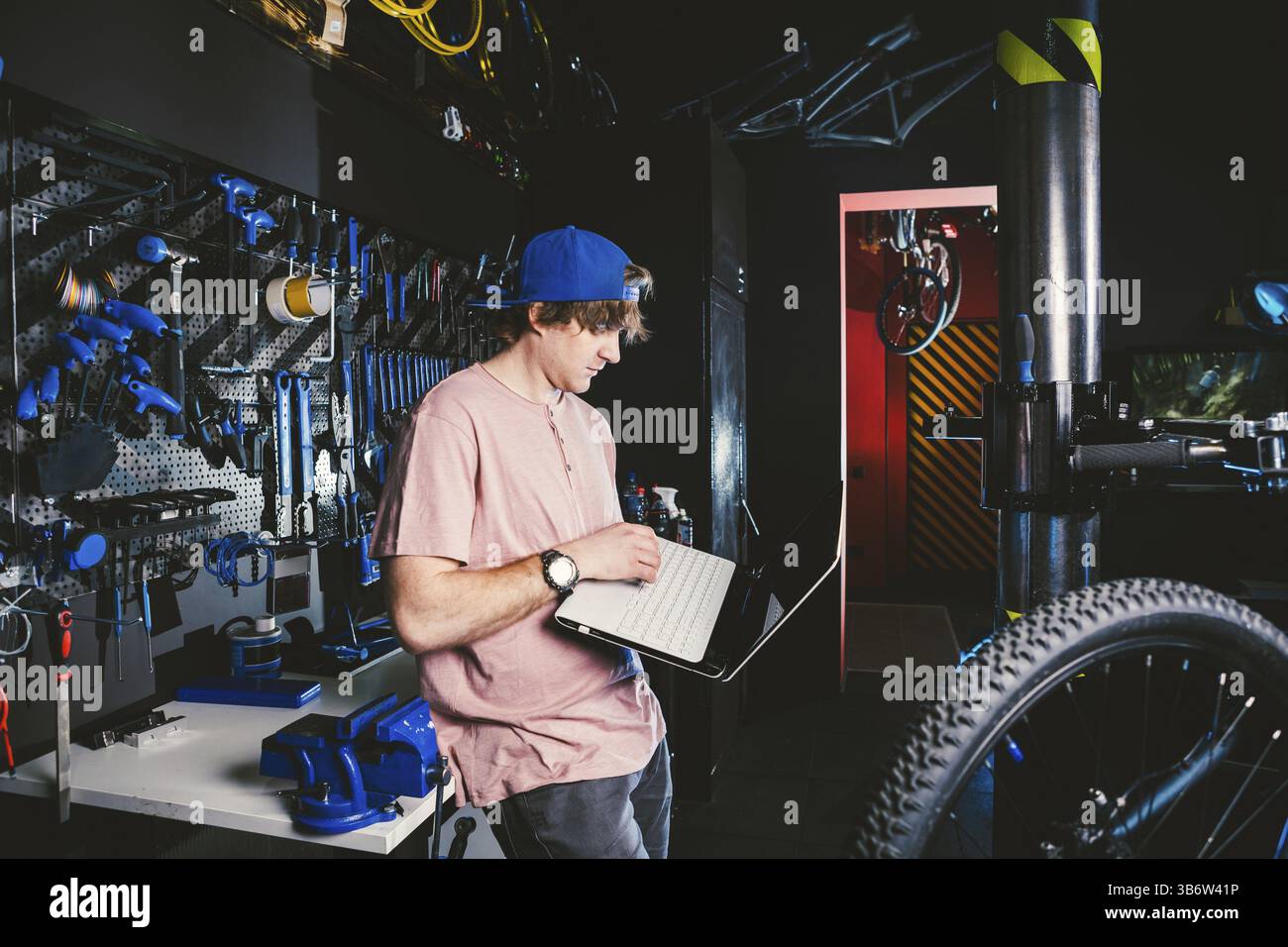 Technician uses computer workstation hi-res stock photography and ...