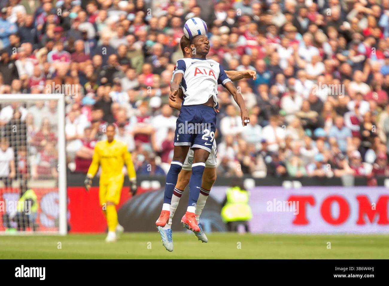 Pape Matar Sarr of Tottenham Hotspur contest for a header during the ...