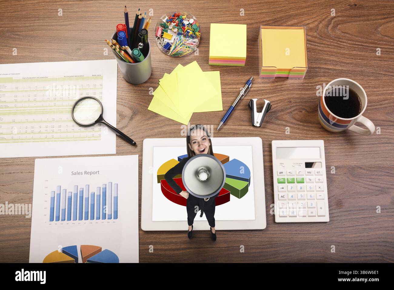 Woman with megaphone on office table. Desk office financial accounting ...