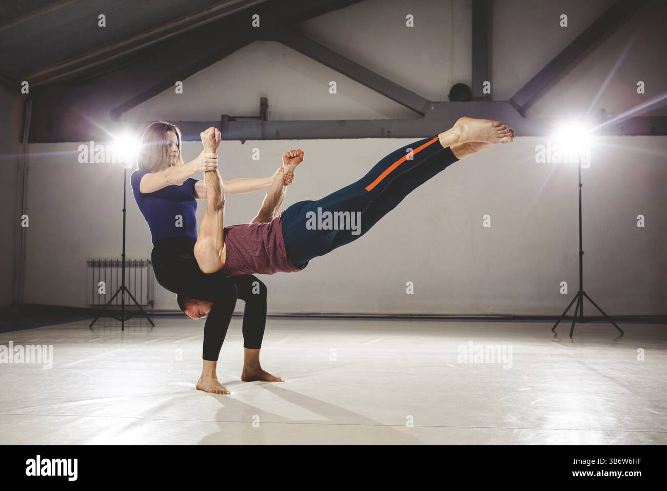 The theme of Acroyoga and Yoga Poses. Acroyogis practicing. with the ...