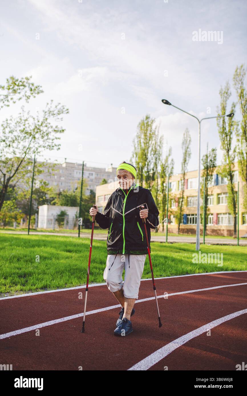 Elderly female athlete using hi-res stock photography and images - Alamy