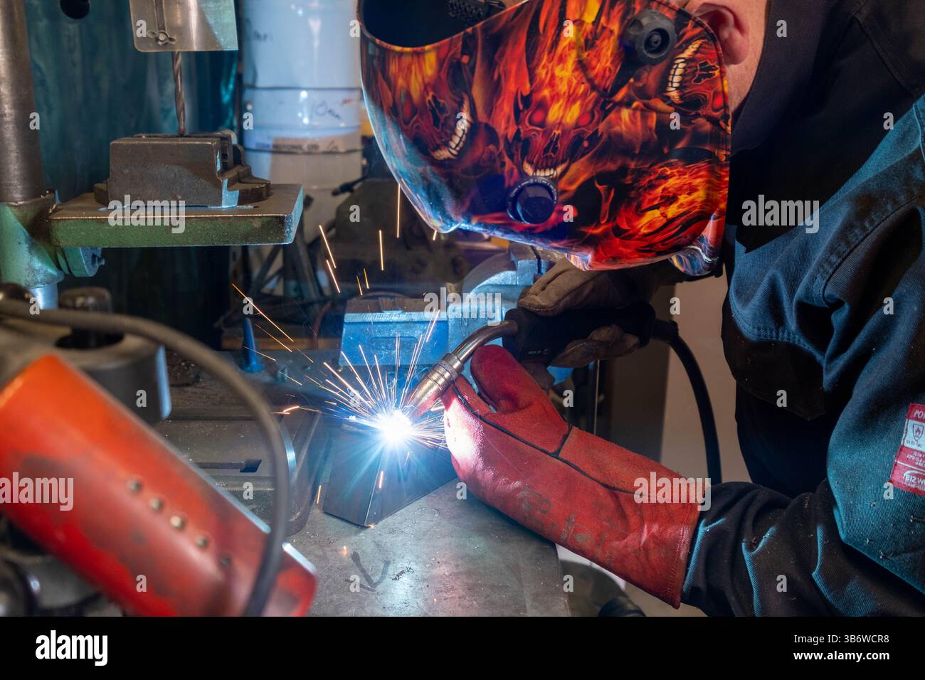 engineer welding in a workshop Stock Photo - Alamy