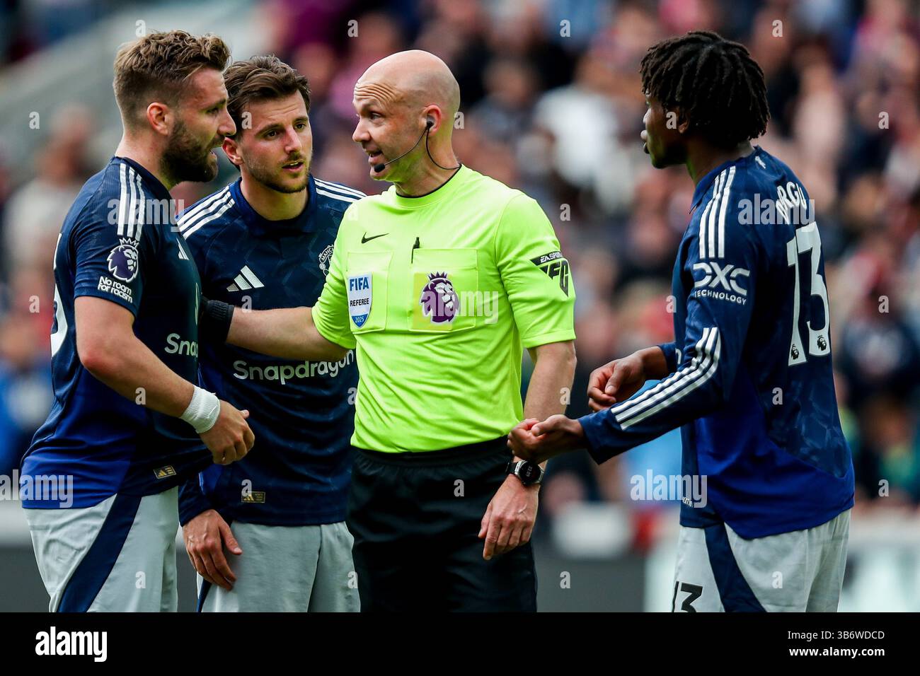 Luke Shaw of Manchester United speaks to Referee Anthony Taylor during ...