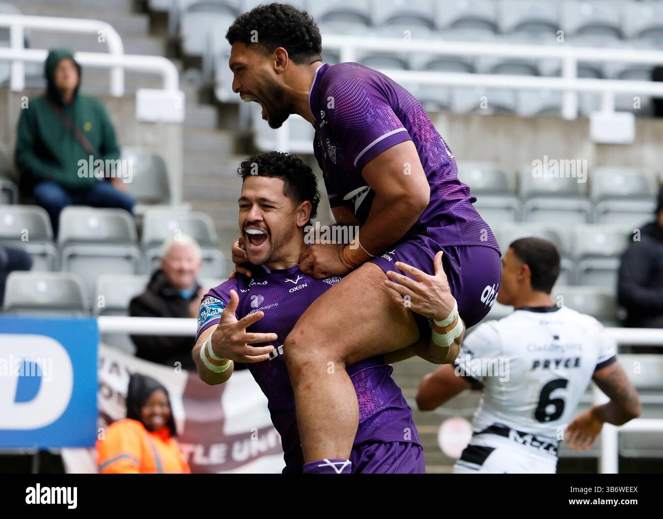 Huddersfield Giants' Jacob Gagai (left) celebrate scoring his side's ...