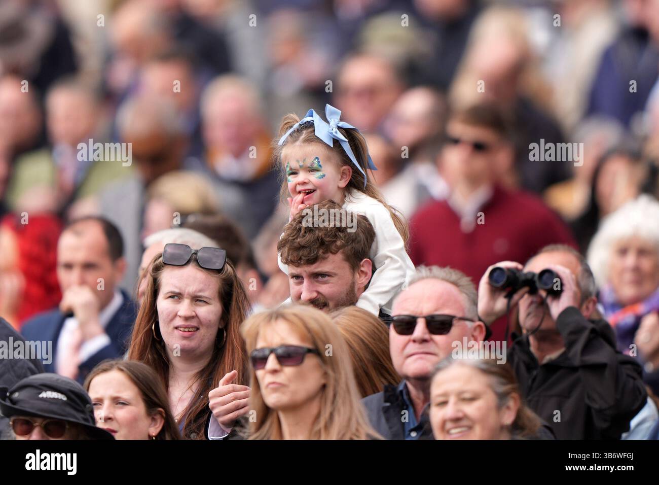 Racegoers watch in the stands on 1000 Guineas Day of the Betfred ...
