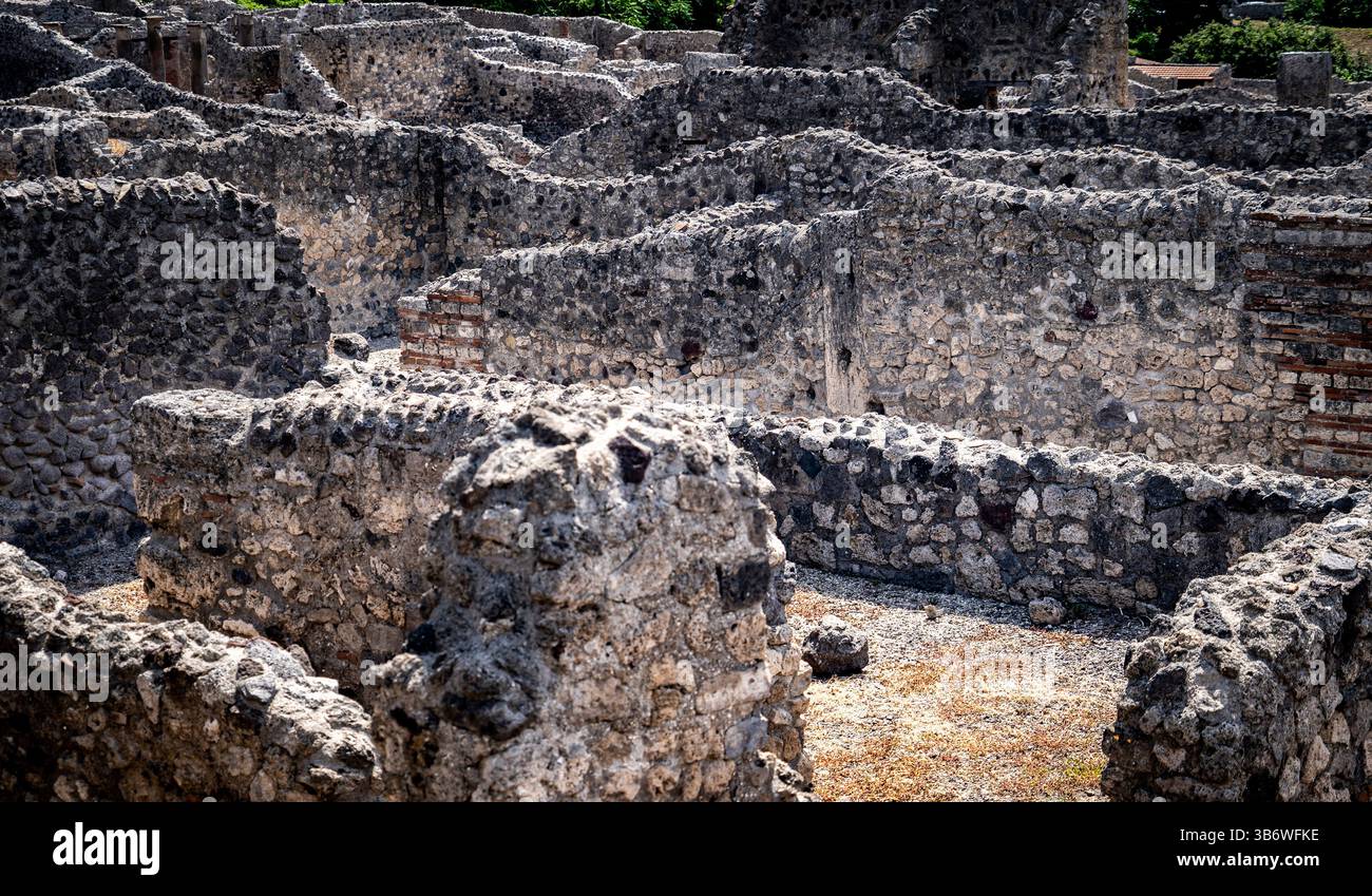 Ruins of ancient stone structures with weathered walls and scattered ...