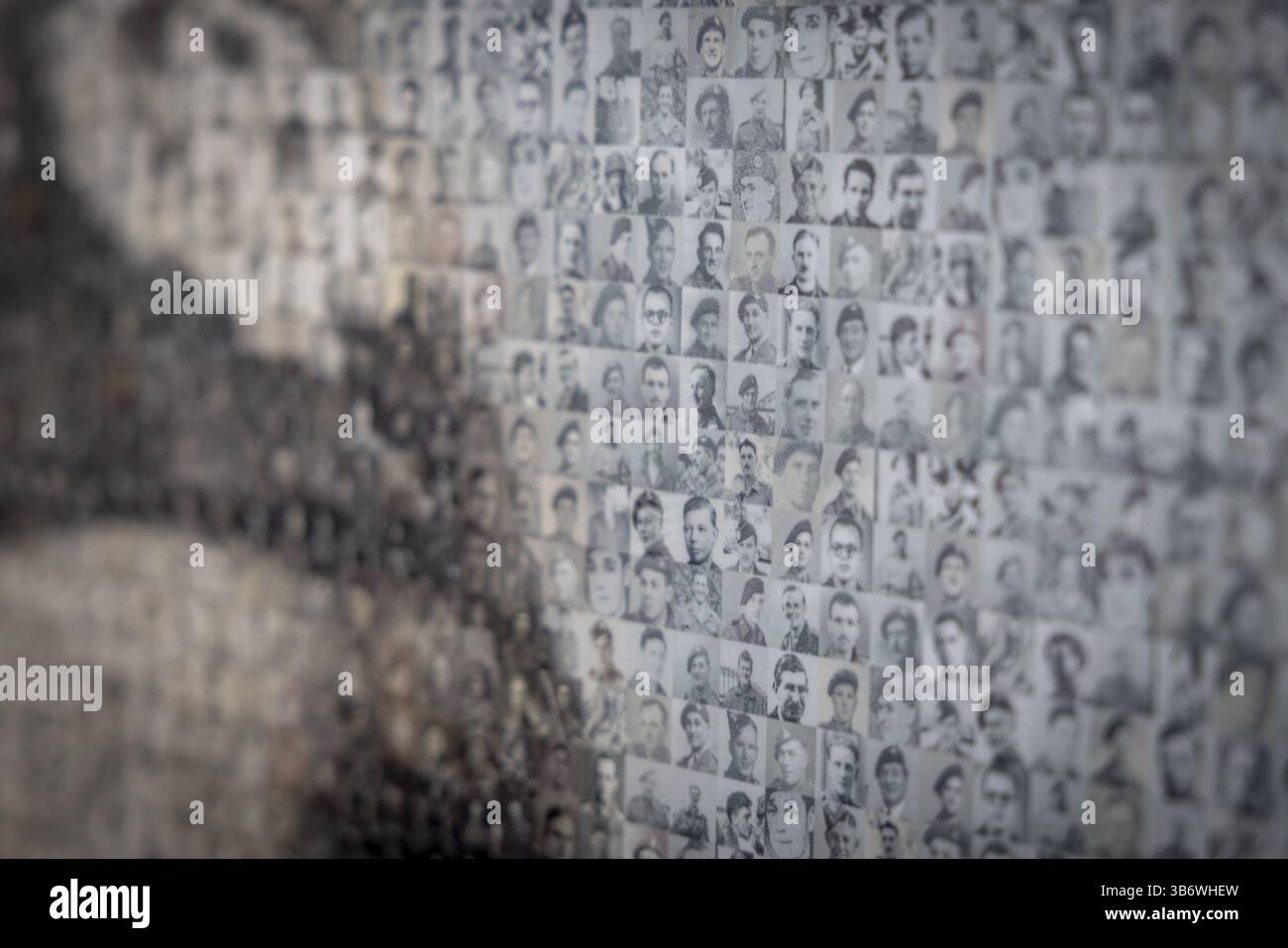 ARNHEM - People look at the new plaque on the monument at the John ...