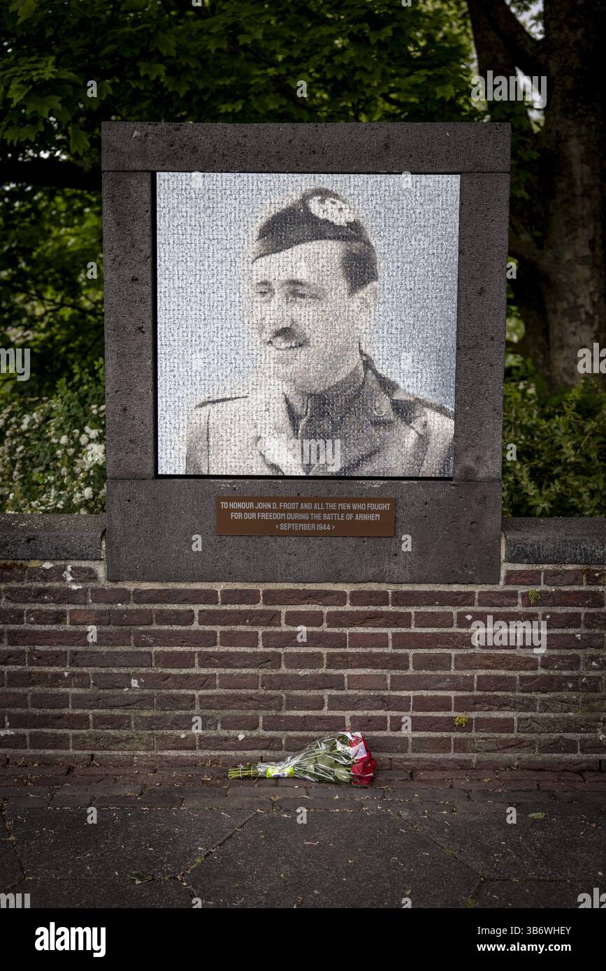 ARNHEM - People look at the new plaque on the monument at the John ...
