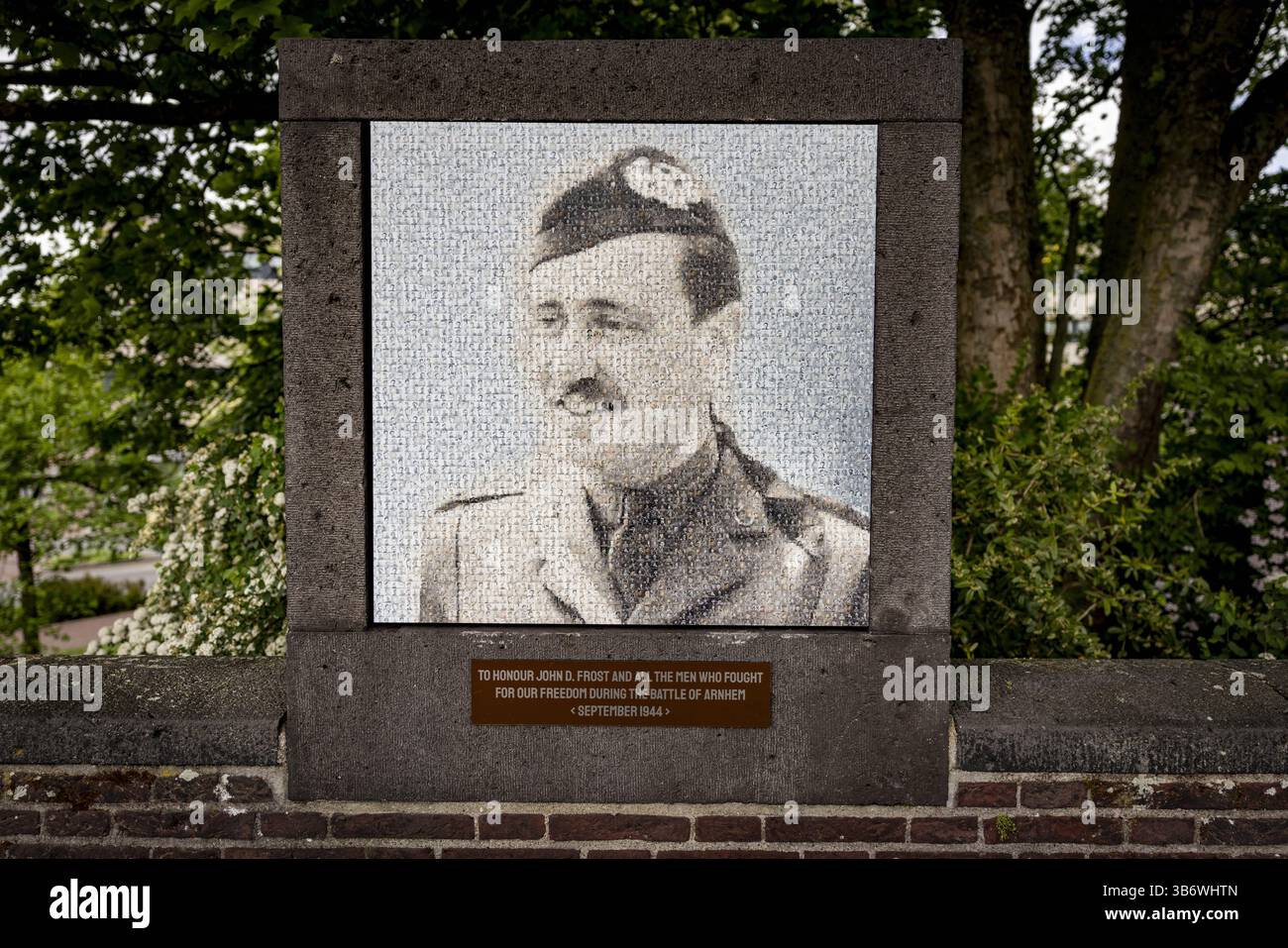 ARNHEM - People look at the new plaque on the monument at the John ...