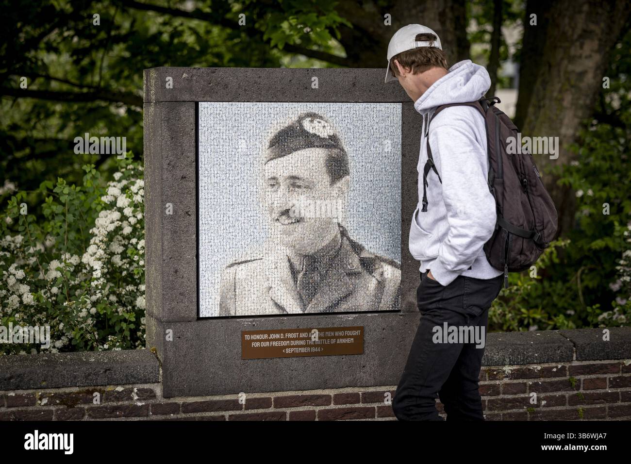 ARNHEM - People look at the new plaque on the monument at the John ...