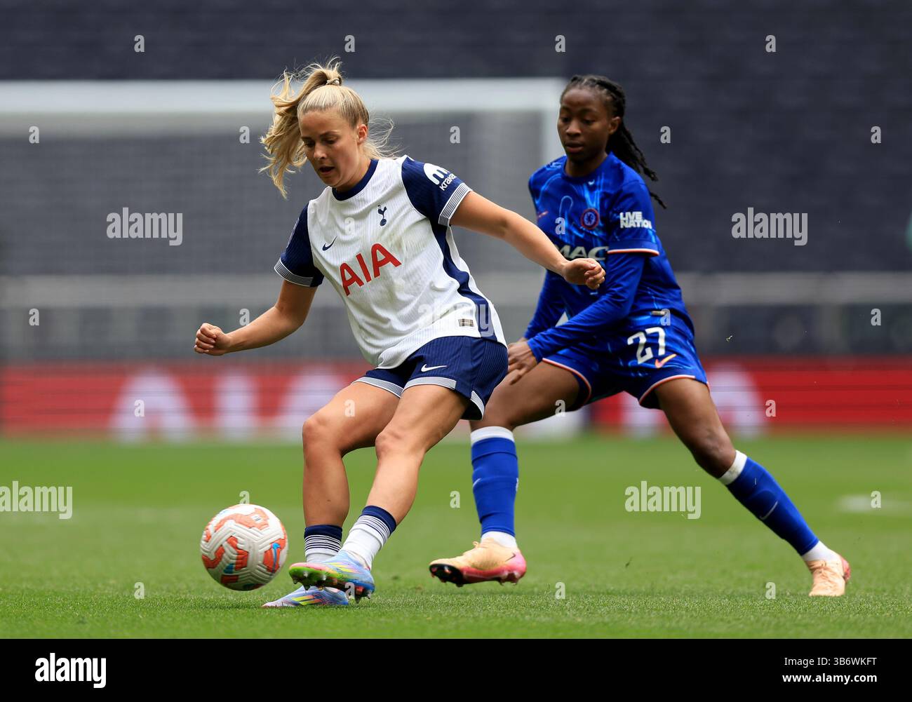 Tottenham Hotspur's Olivia Holdt (left) and Chelsea's Oriane Jean ...