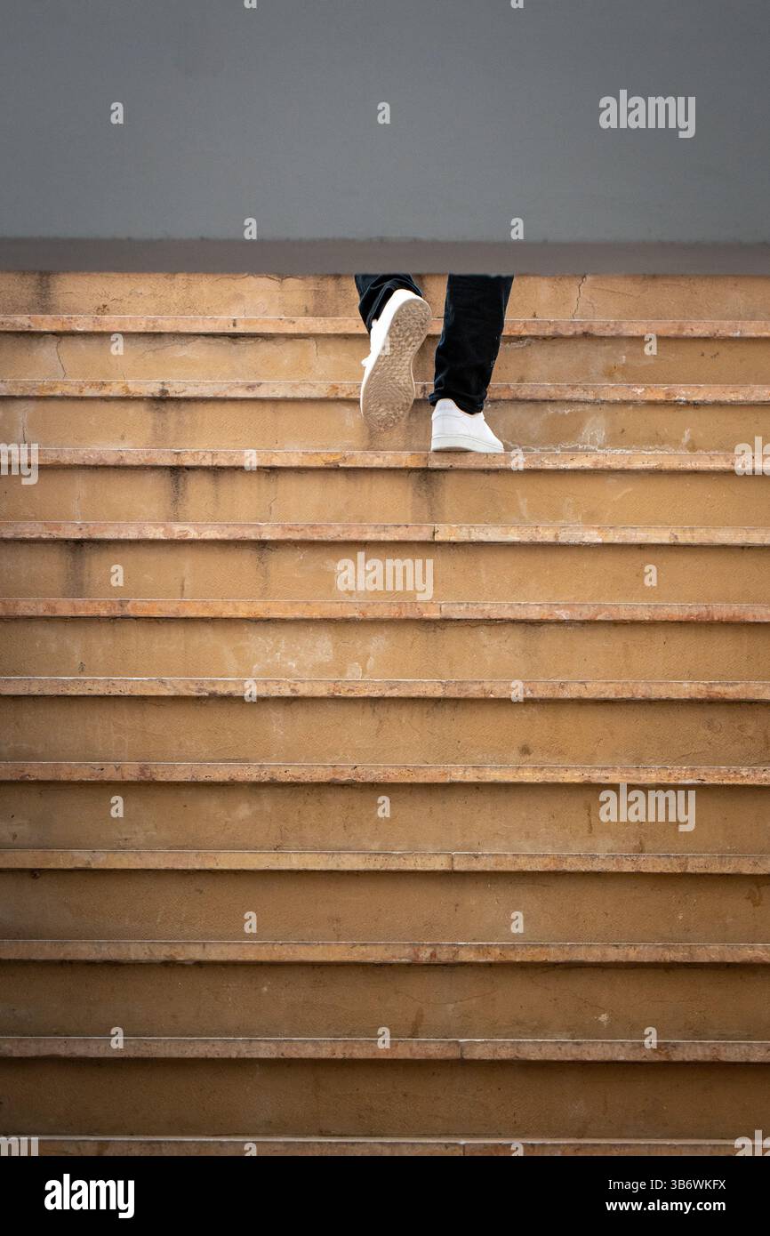 Figure going up stairs hi-res stock photography and images - Alamy