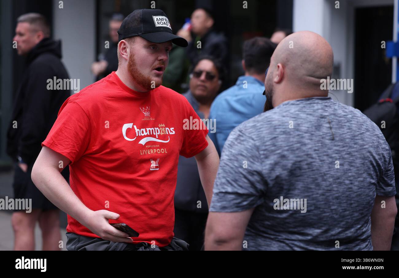 London, UK. 4th May, 2025. A Liverpool fan with a Champions shirt on ...