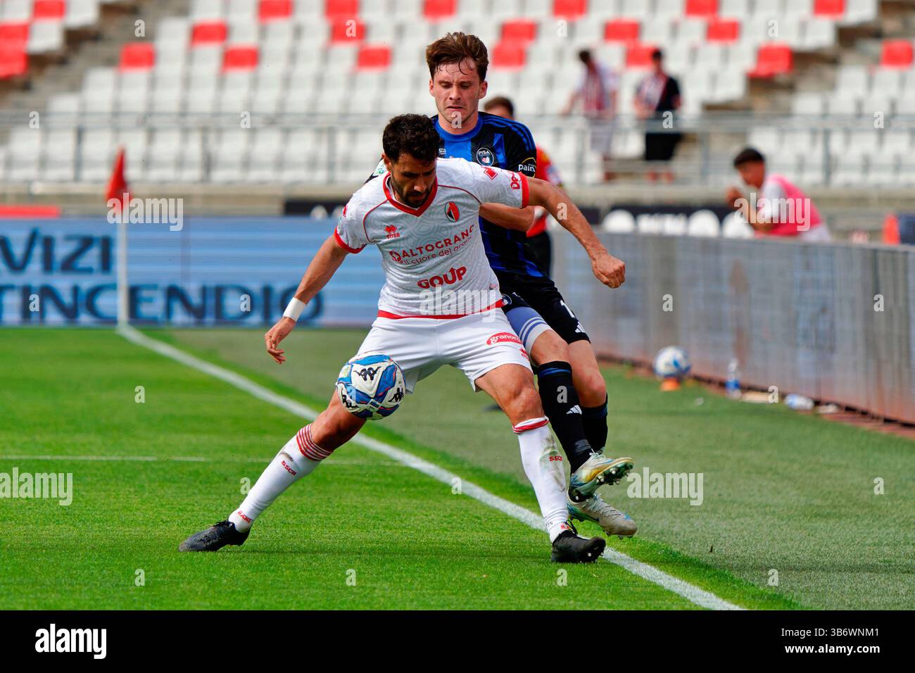 Raffaele Pucino of SSC Bari in action against Matteo Tramoni of Pisa ...