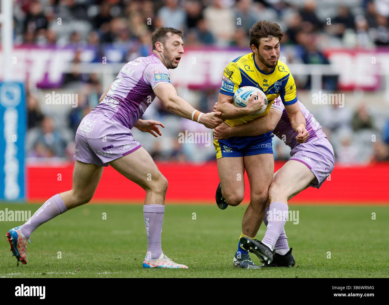 Warrington Wolves' Adam Holroyd gets tackled during the Betfred Super ...