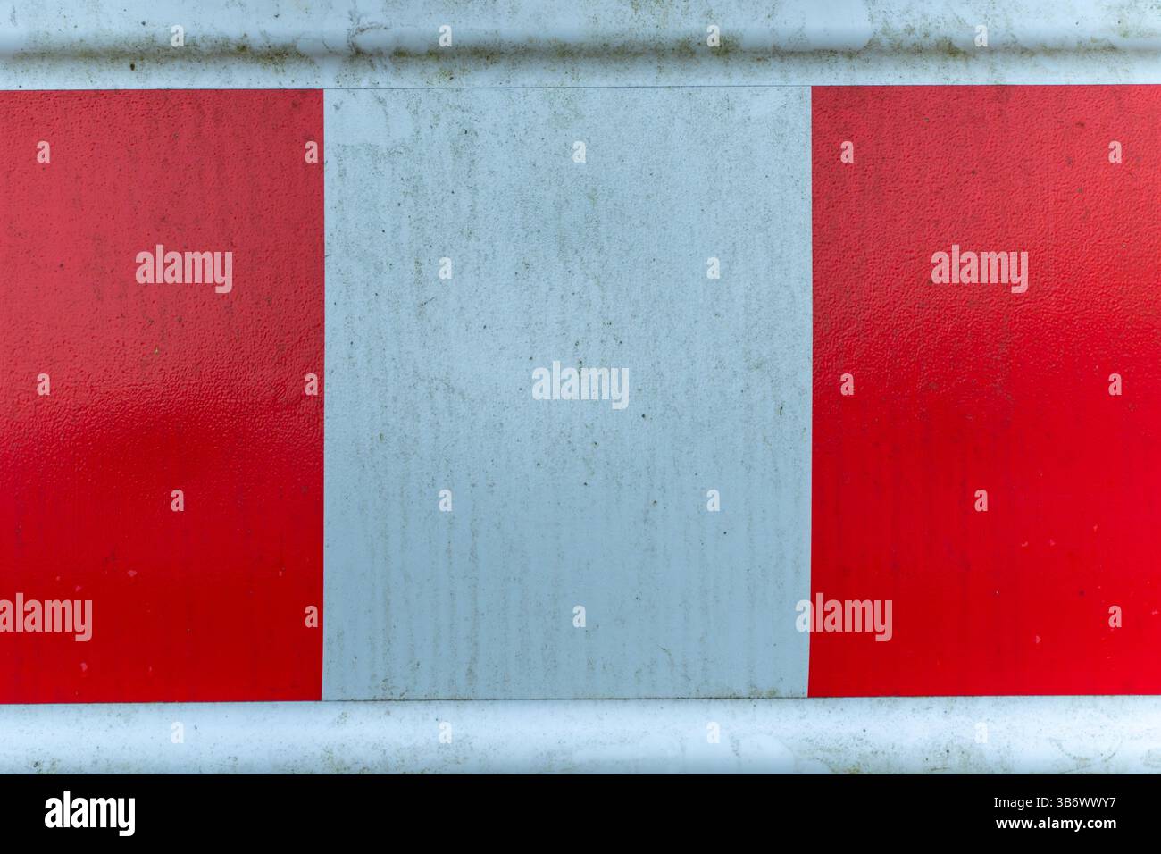 A red and white striped sign. The red stripe is on the left and the ...