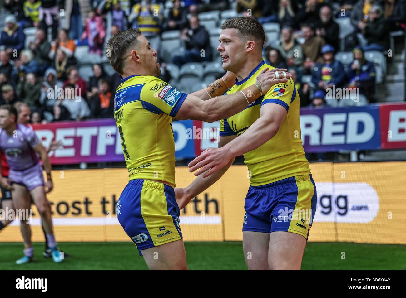Jake Thewlis of Warrington Wolves celebrates his try during the Betfred ...