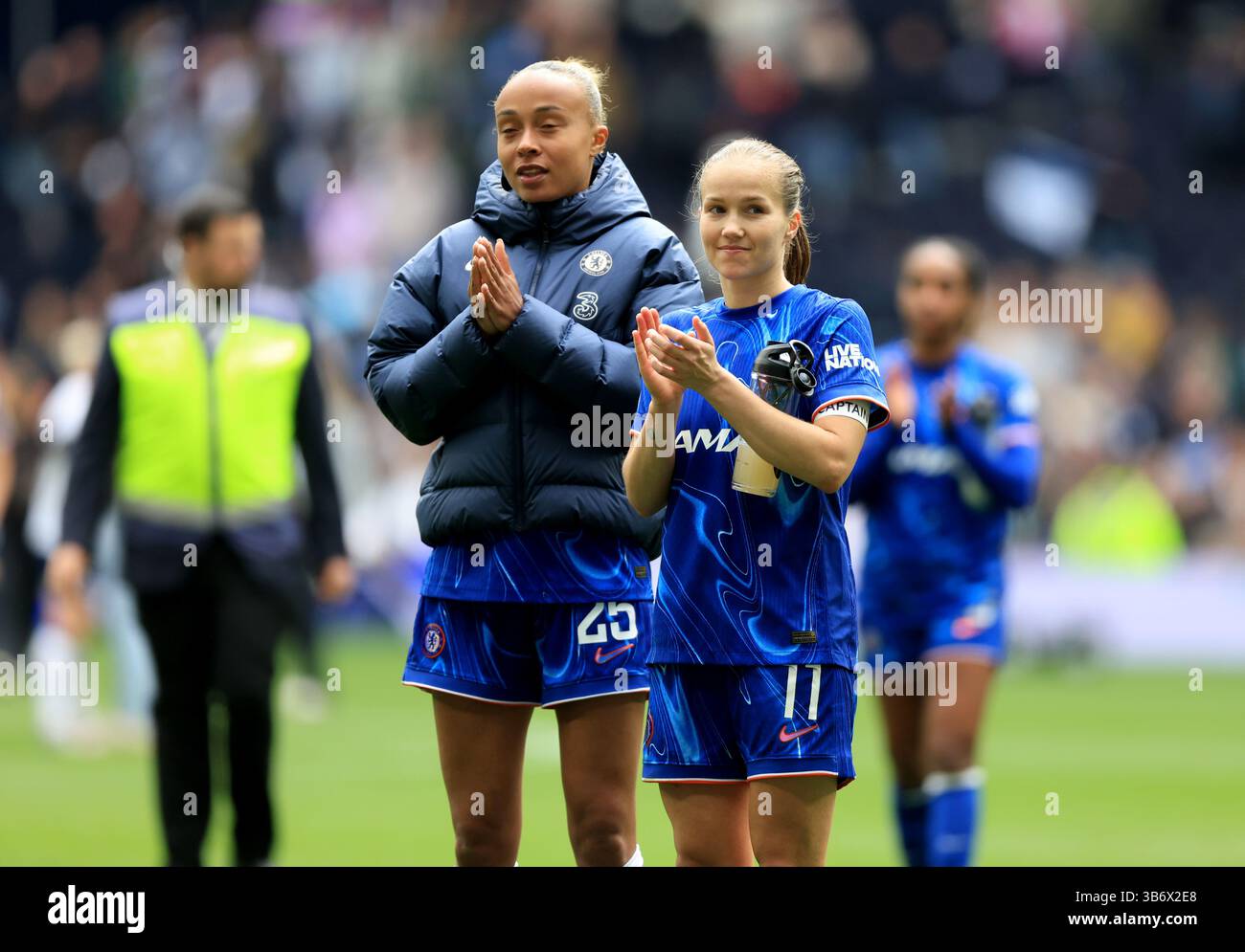 Chelsea's Maelys Mpome (left) and Chelsea's Guro Reiten applaud the ...