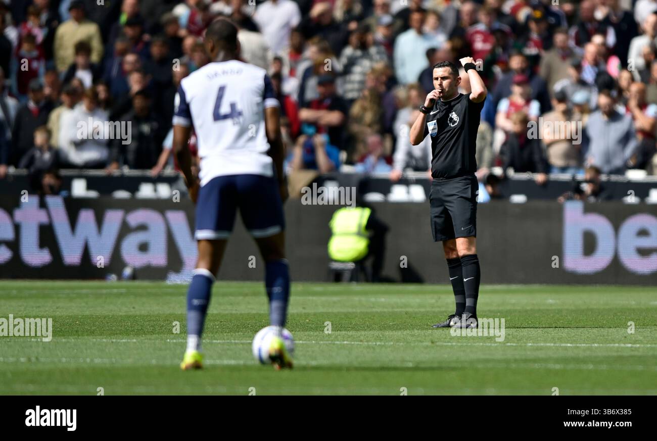 London, UK. 4th May, 2025. Michael Oliver (Referee) tells Kevin Danso ...