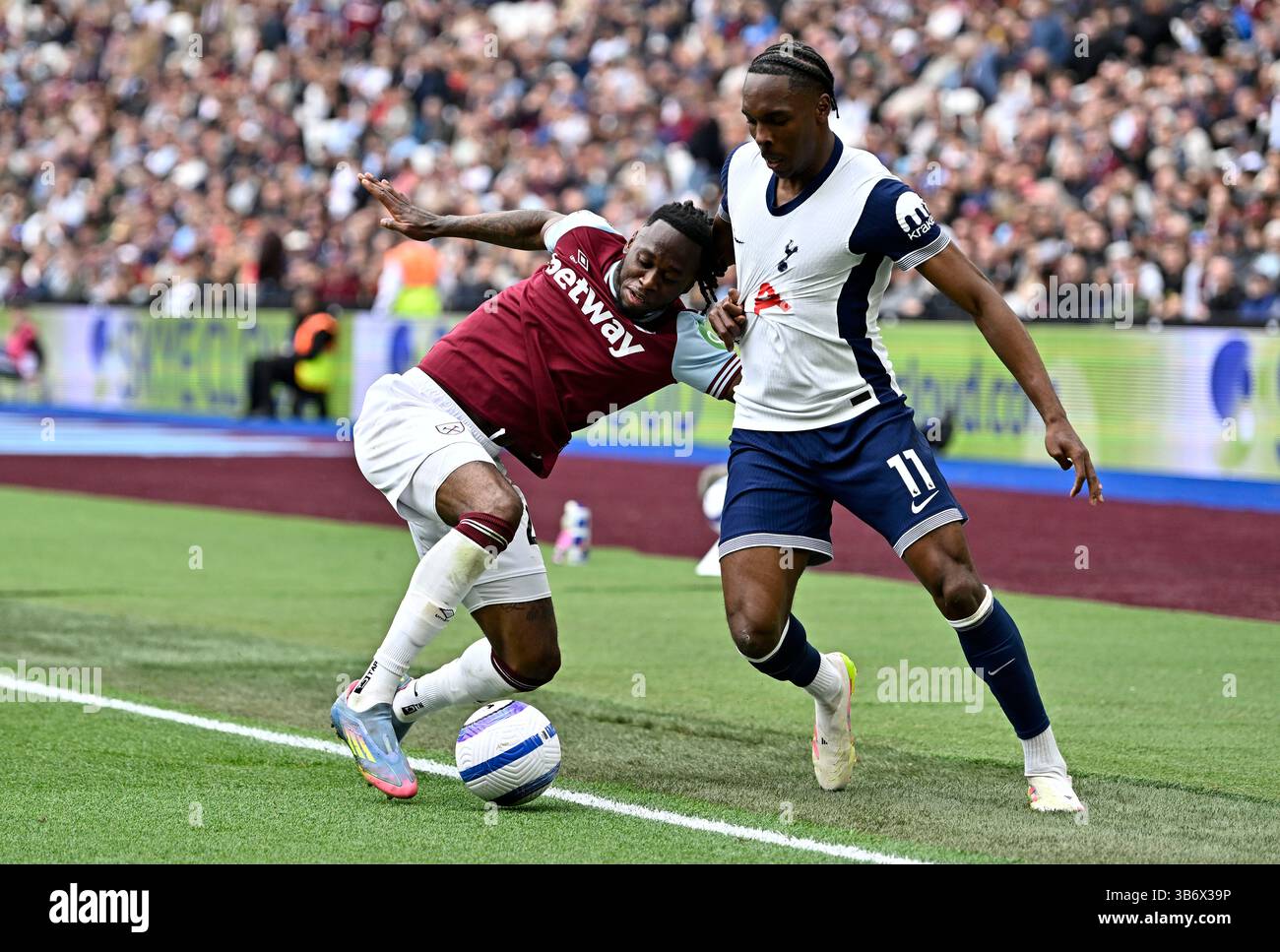 London, UK. 4th May, 2025. Mathys Tel (Spurs) tries to go past Aaron ...