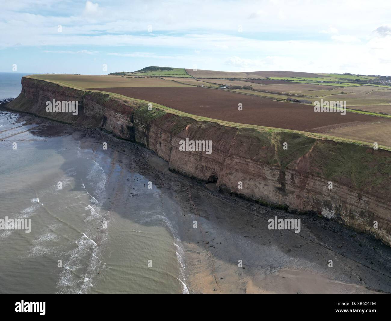 Aerial view of Saltburn Beach, North Yorkshire, showing dramatic cliffs ...