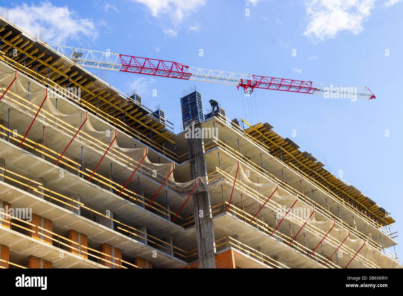 Concrete floors, brick walls and a construction crane. House ...
