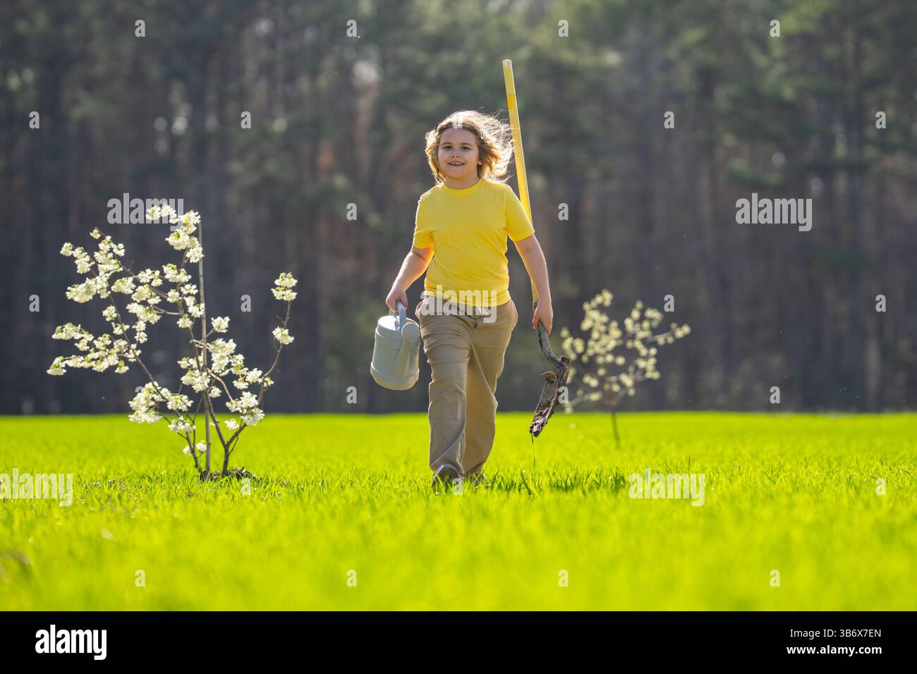 Portrait of a kid planting tree. Kid gardener. Kid working in the ...