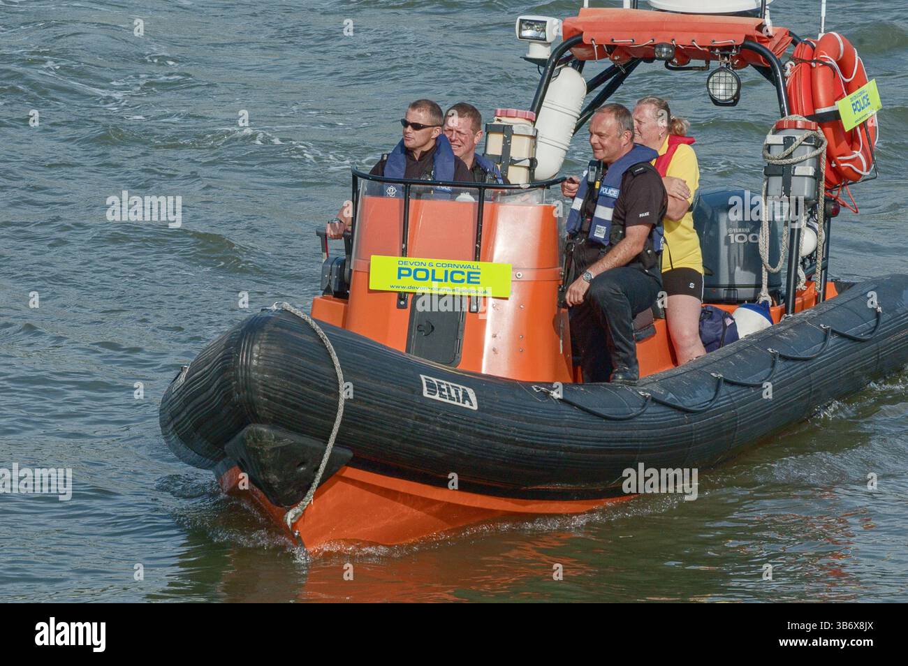 Devon and Cornwall police inflatable craft sails in Dartmouth estuary ...