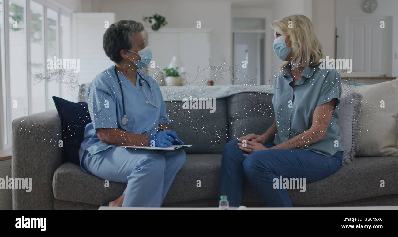 Image of dna strand over diverse doctor and patient Stock Photo - Alamy
