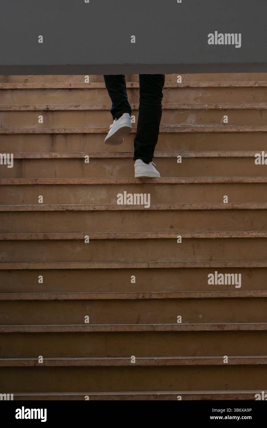 Figure going up stairs hi-res stock photography and images - Alamy