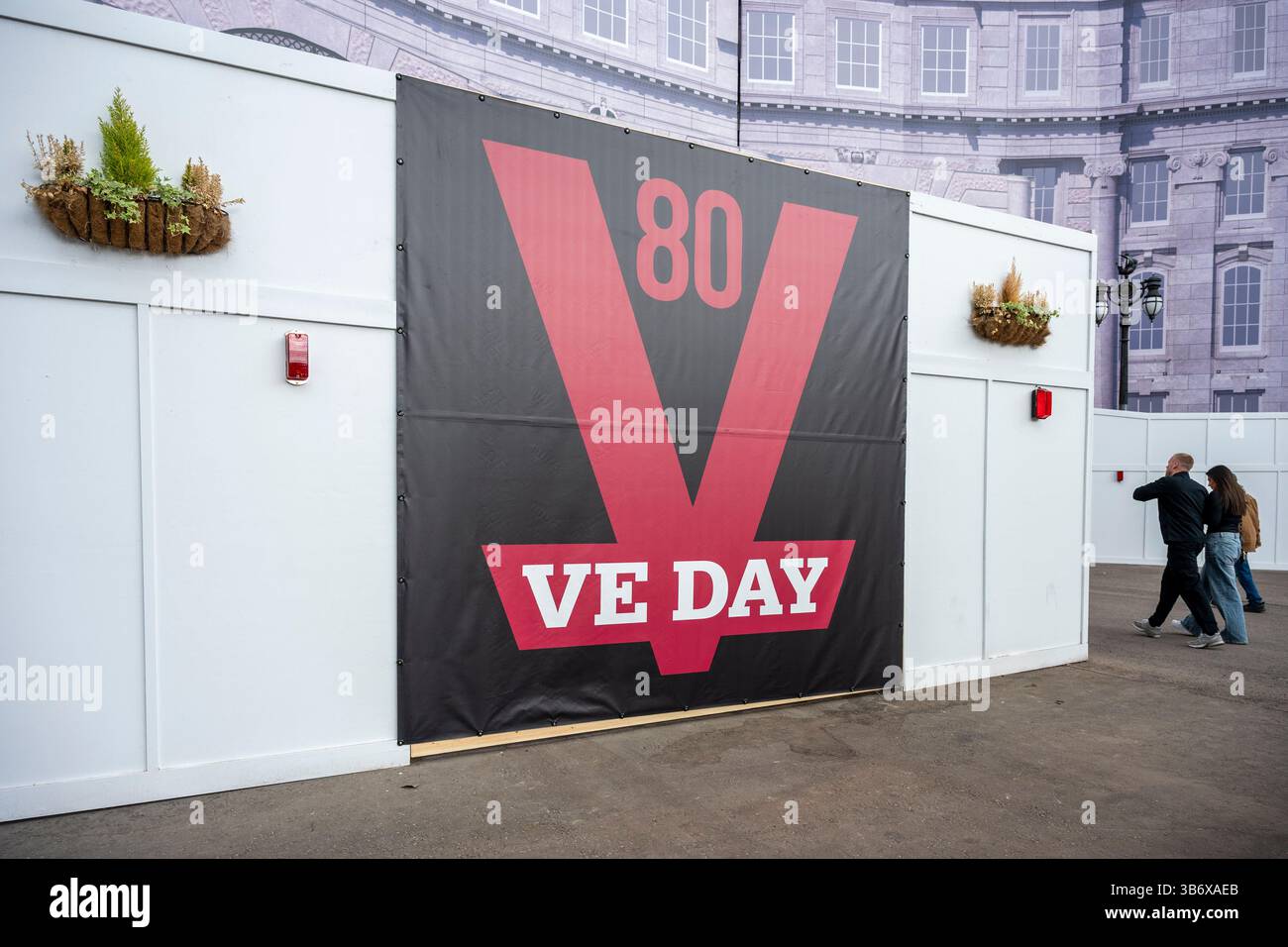 London, UK. 4 May 2025. A VE Day 80 sign on the construction facade ...