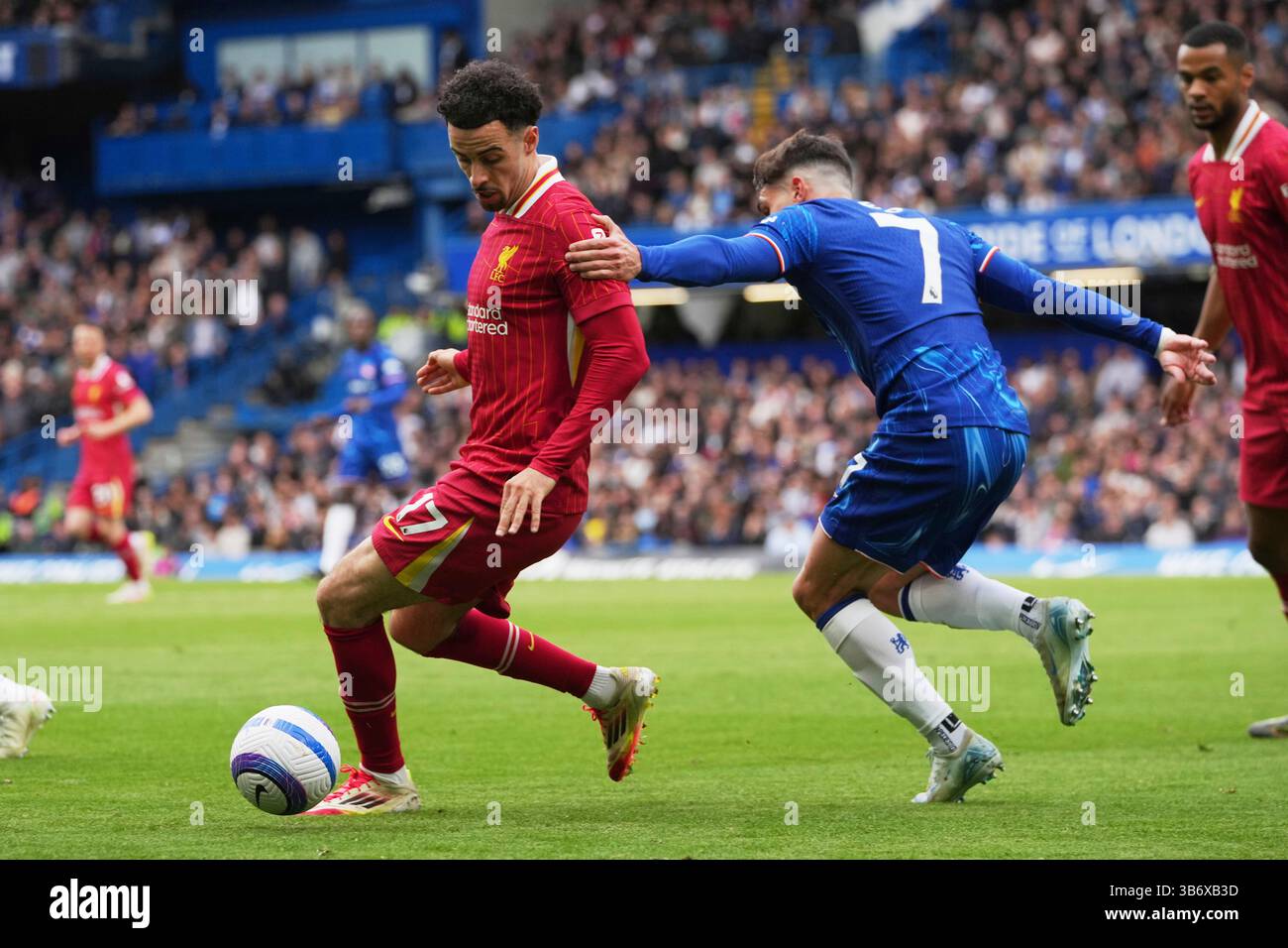 Chelsea's Pedro Neto, right, challenges Liverpool's Curtis Jones during ...
