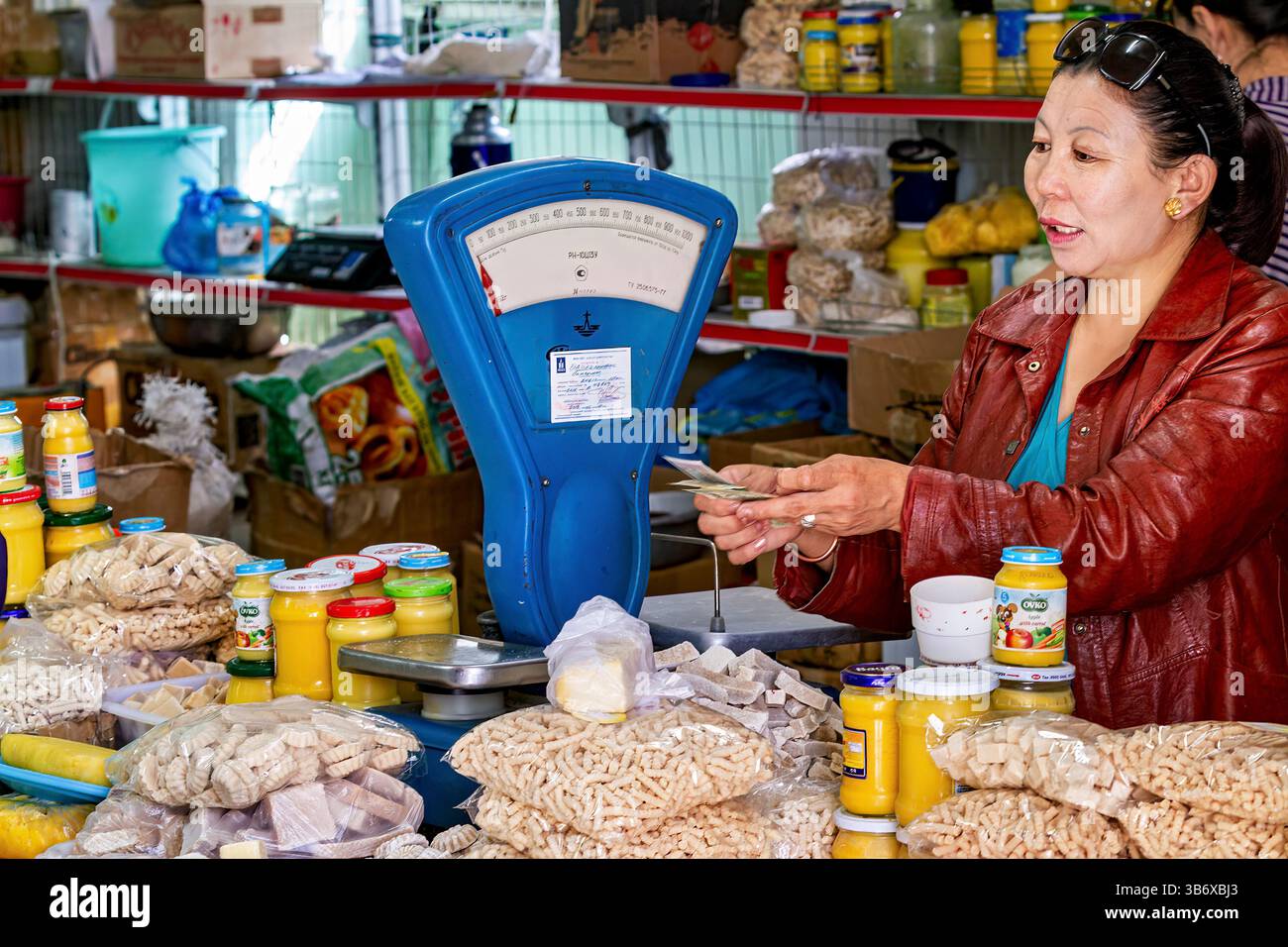 Market Woman in a shop in Mongolia Stock Photo - Alamy