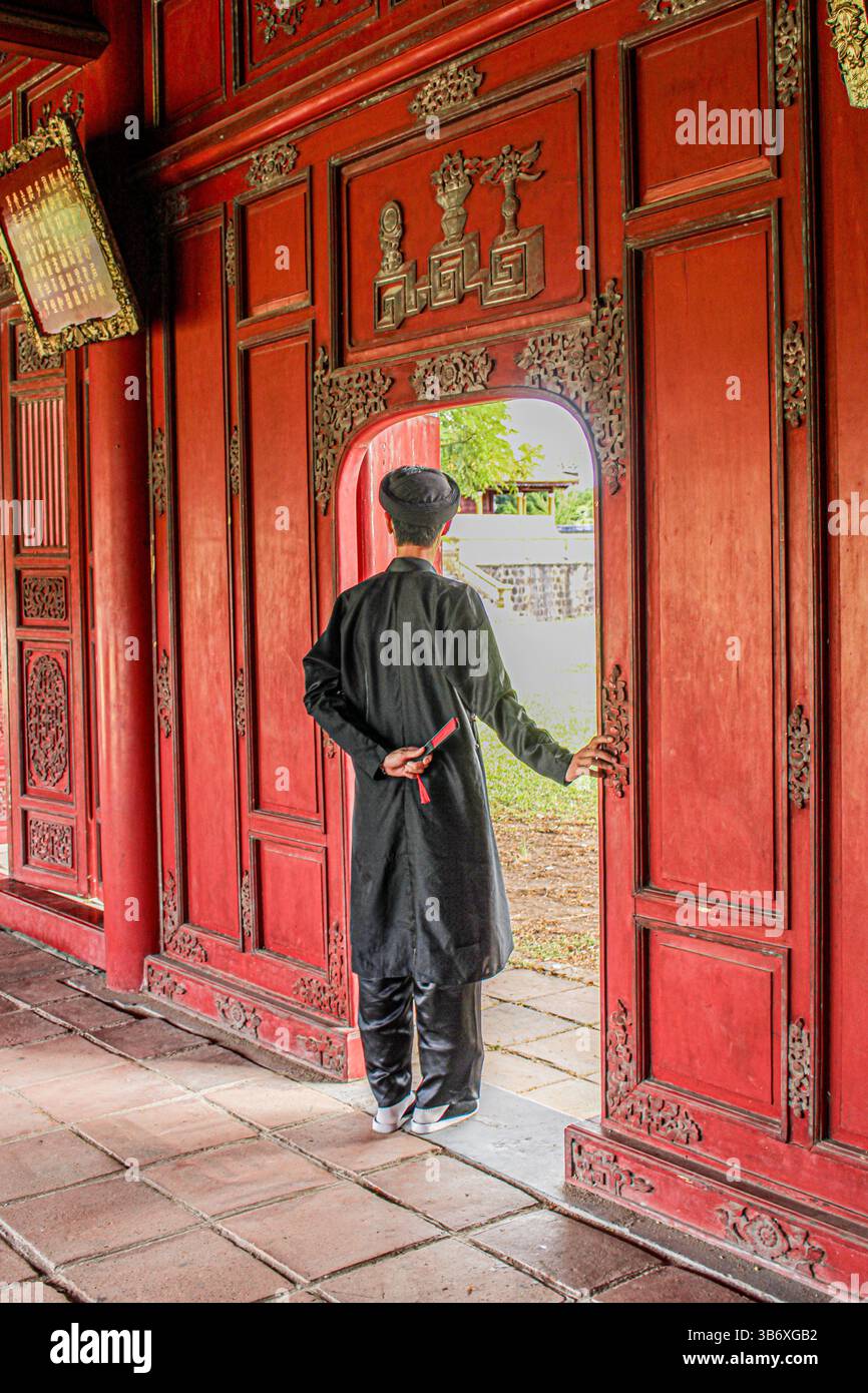 Vietnam, Hue. Hue Imperial City (Hoàng Thành Huế). A man in traditional ...