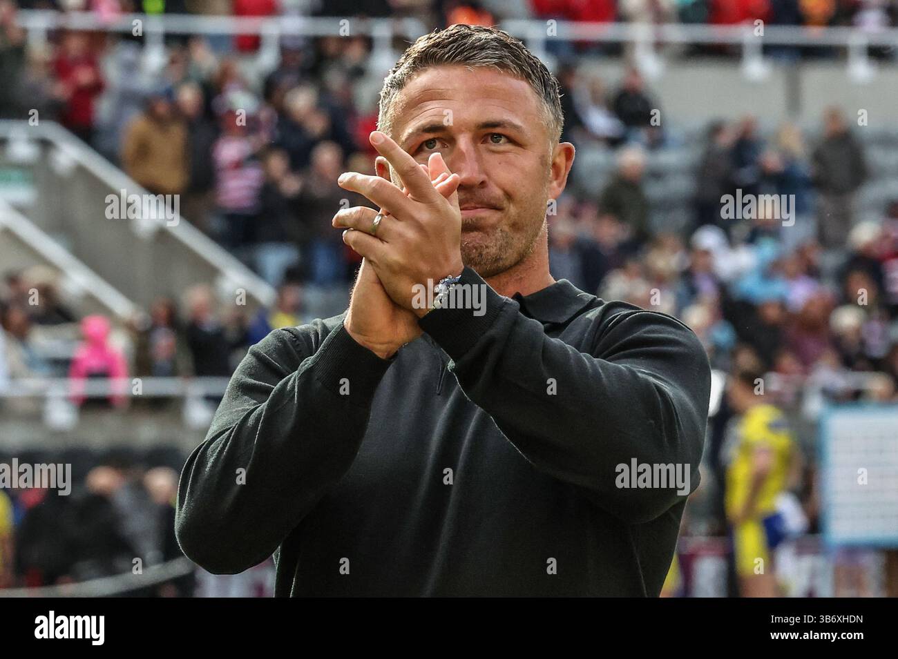 Sam Burgess Head Coach of Warrington Wolves applauds the fans after the ...