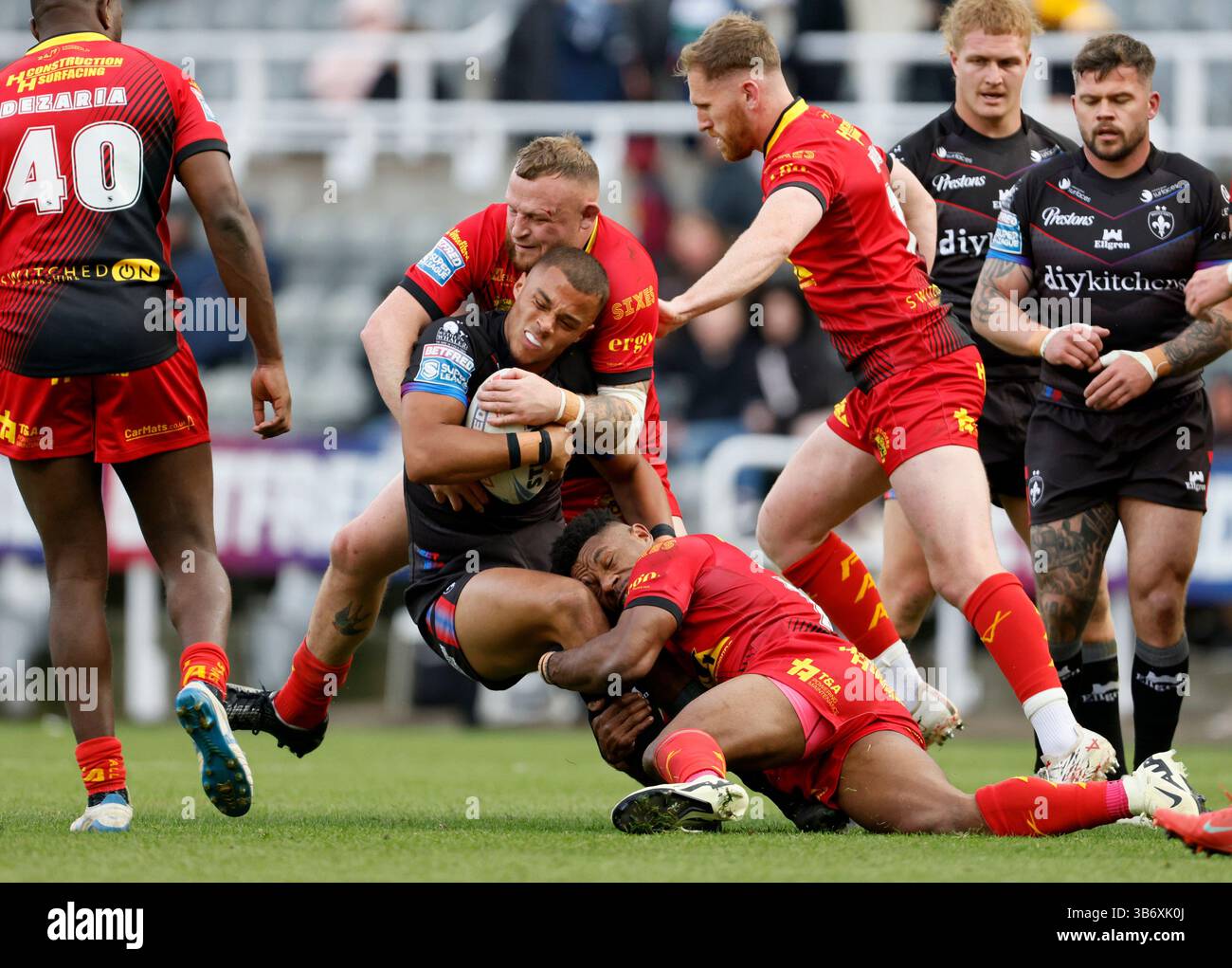 Wakefield Trinity's Corey Hall (centre) is tackled during the Betfred ...
