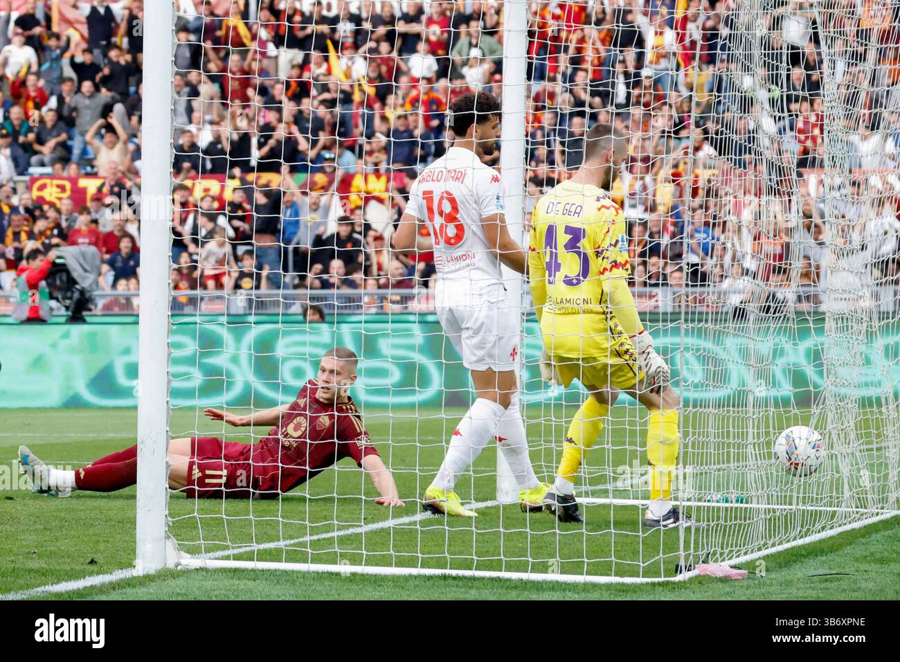 Rome, Italy. 4th May, 2025. Artem Dovbyk, of Roma, left, reacts after ...