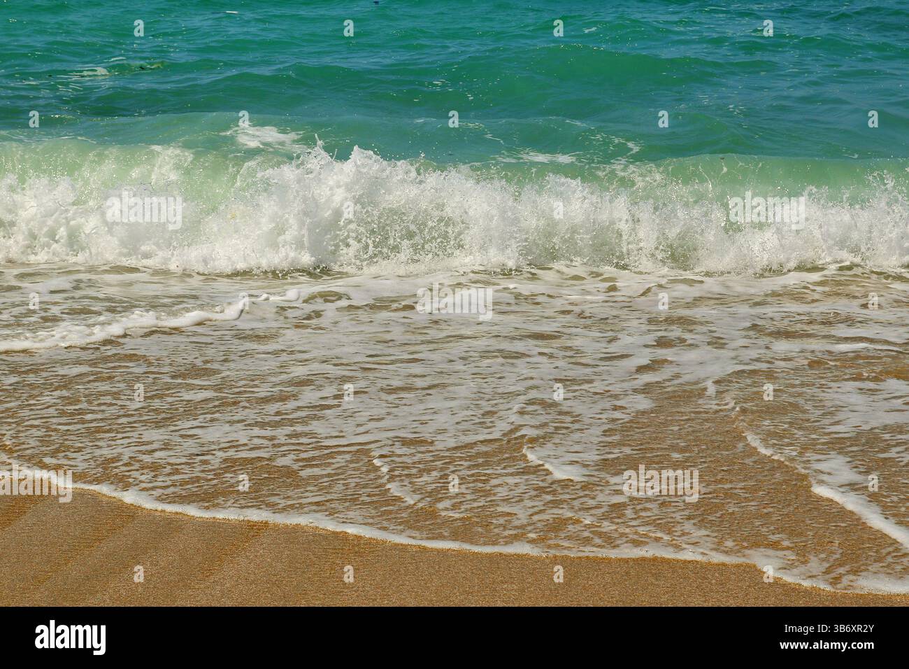 Turquoise waves gently roll onto hi-res stock photography and images ...